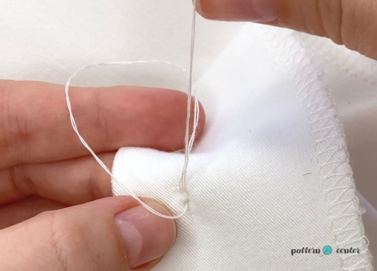 How to Sew a Button on a Shirt by Hand (With Photos & Video)