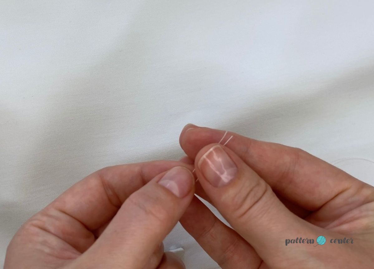 How to Sew a Button on a Shirt by Hand (With Photos & Video)