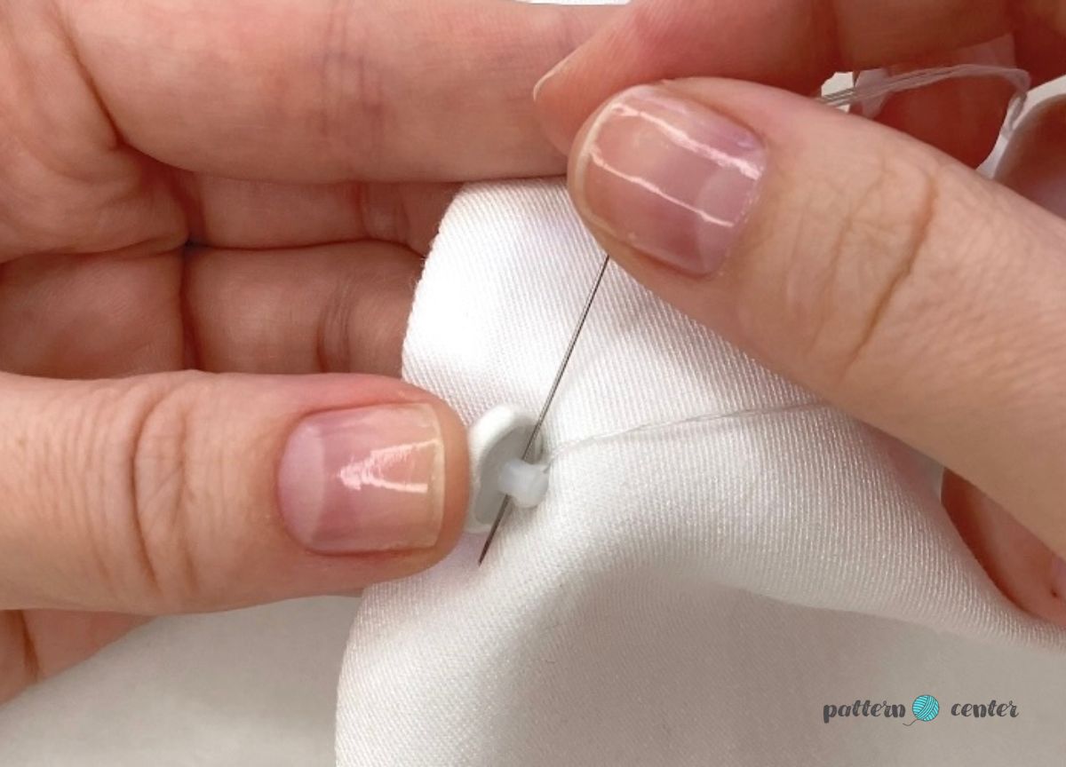 How to Sew a Button on a Shirt by Hand (With Photos & Video)