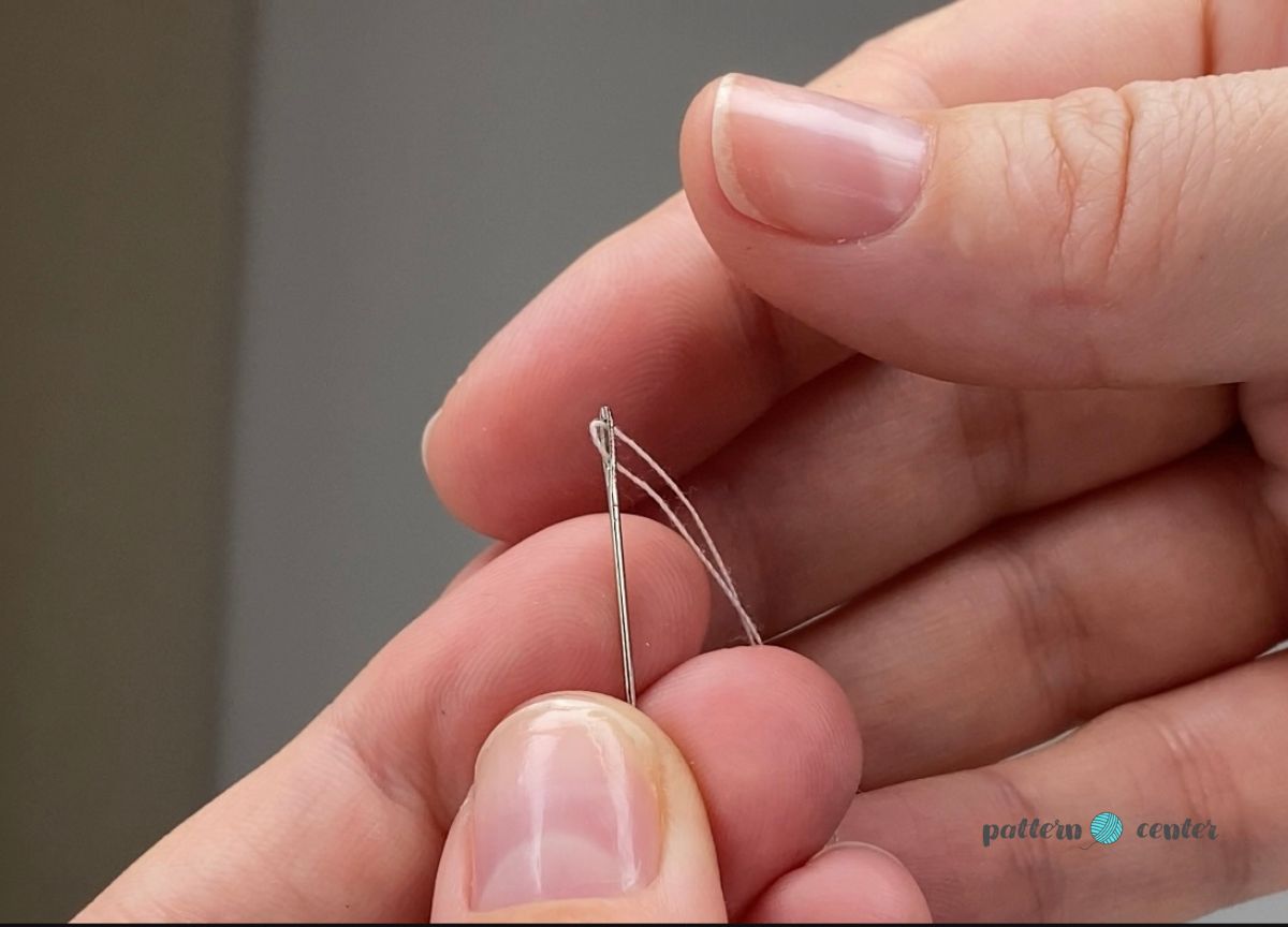 How to Sew a Button on a Shirt by Hand (With Photos & Video)