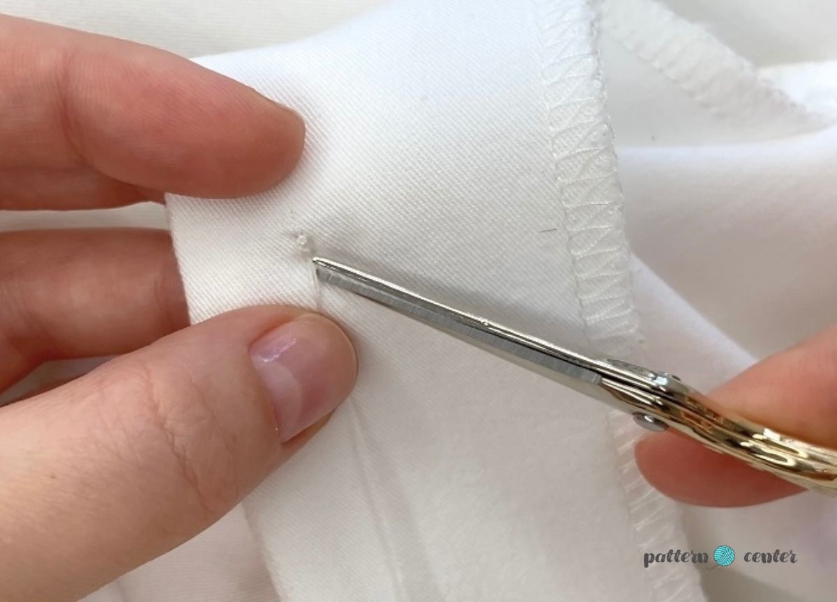 How to Sew a Button on a Shirt by Hand (With Photos & Video)