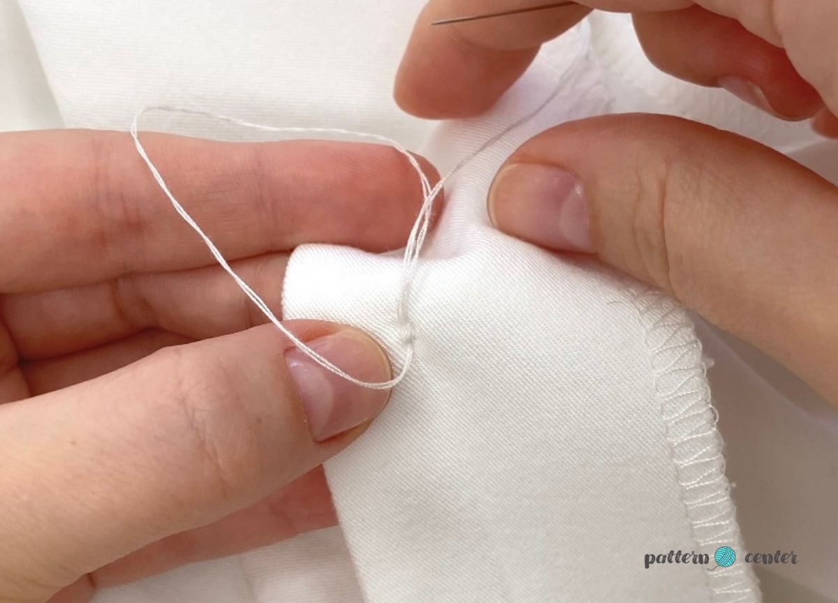 How to Sew a Button on a Shirt by Hand (With Photos & Video)